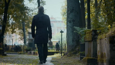 Rear View of Man in Black Walking throug... | Stock Video | Pond5