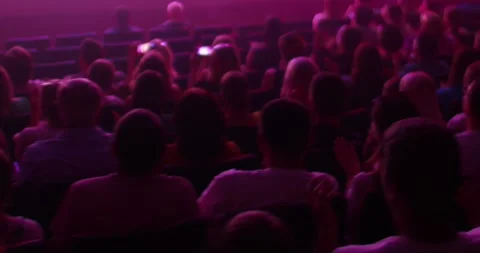 Rear view of people sitting in a full ha... | Stock Video | Pond5
