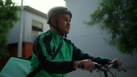 Rear view Rider food delivery man wearin... | Stock Video | Pond5