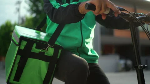 Rear view Rider food delivery man wearin... | Stock Video | Pond5