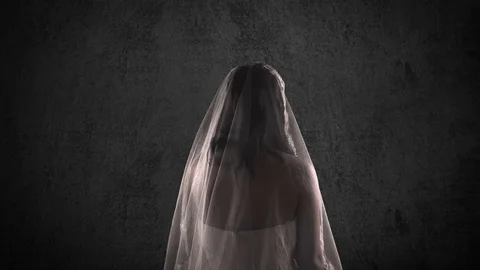 Rear view of scary zombie looking at cam... | Stock Video | Pond5