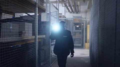 Rear View Of A Security Guard Standing | Stock Video | Pond5