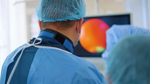 Rear view of a surgeon wearing x-ray pro... | Stock Video | Pond5