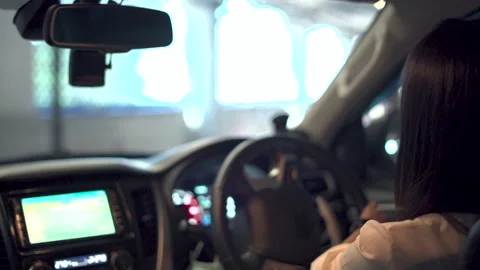 Rear view woman driving through indoor p... | Stock Video | Pond5