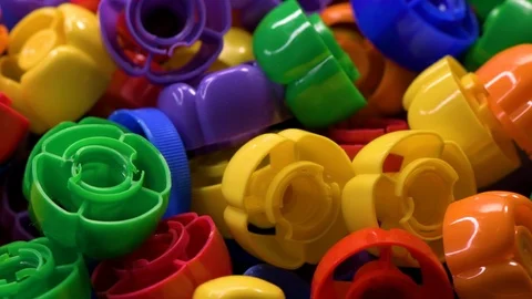 Recycled plastic bottle caps on rotating... | Stock Video | Pond5