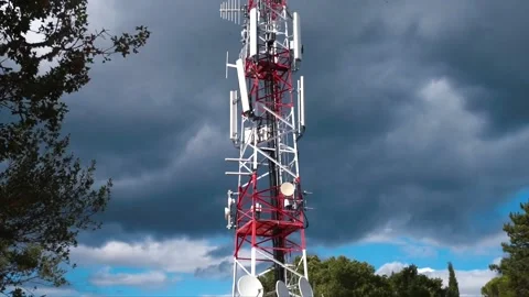 Red and white cell tower with many diffe... | Stock Video | Pond5