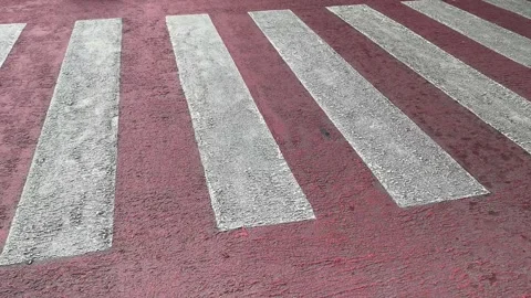Red and white zebra crossing on ground p... | Stock Video | Pond5