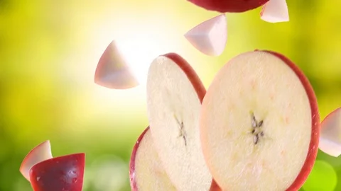 Red Apple with Slices Falling on Garden ... | Stock Video | Pond5