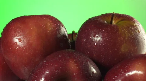 Red Apples isolated rotating on green ba... | Stock Video | Pond5