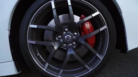 Red Brake Calipers On Black Rims. Nissan... | Stock Video | Pond5