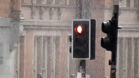 Red British stop traffic light during ra... | Stock Video | Pond5