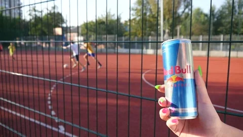 Red Bull Aluminium Can in front of Child... | Stock Video | Pond5