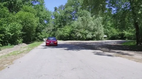 Red car moving on highway road during su... | Stock Video | Pond5