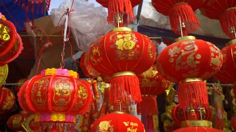 Red Chinese flashlight during the day. | Stock Video | Pond5