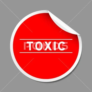 Red color peel sticker label with word toxic on gray background ...
