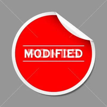 Red color peel sticker label with word modified on gray background ...