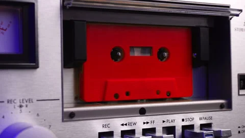 Red Compact Audio Cassette Tape Rolling ... | Stock Video | Pond5