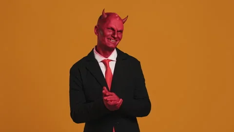 Red devil businessman clapping hands on ... | Stock Video | Pond5