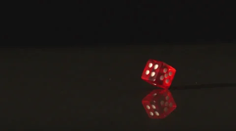 Red dice revolving on black background | Stock Video | Pond5