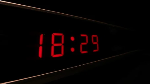 Red digital display clock with 24-hour t... | Stock Video | Pond5