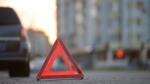 Red emergency stop sign behind broken bl... | Stock Video | Pond5