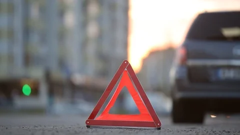 Red emergency stop sign behind broken bl... | Stock Video | Pond5