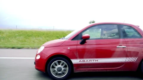 Red Fiat Abarth mini italian car driving... | Stock Video | Pond5