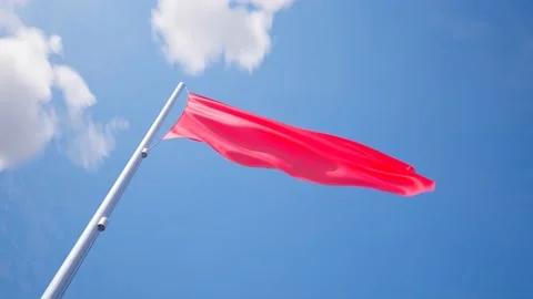 A red flag waving on a wind with beautif... | Stock Video | Pond5