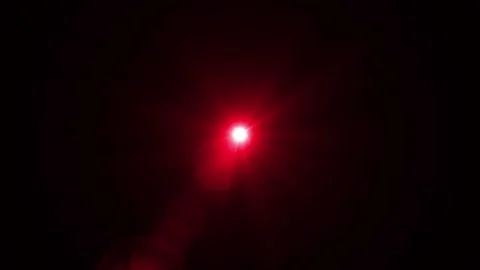 Red flare light beam with particles effe... | Stock Video | Pond5