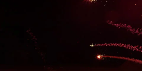 Red flares curve across the frame traili... | Stock Video | Pond5
