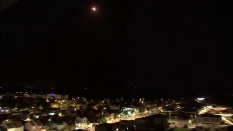 Red flares light up sky over Israel-Gaza... | Stock Video | Pond5