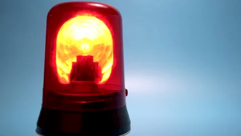 Red flashing light on a blue background. | Stock Video | Pond5