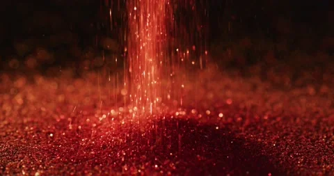 Red glitter gems spilling on black backg... | Stock Video | Pond5