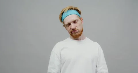 A red-haired guy looking bored trains hi... | Stock Video | Pond5