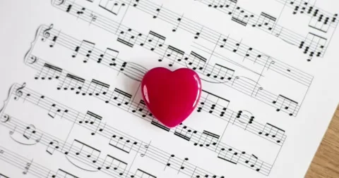 Red heart with musical notes closeup on ... | Stock Video | Pond5