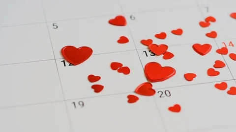 Red heart shapes on calendar | Stock Video | Pond5