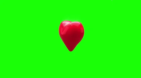 Red heart turning and exploding on green... | Stock Video | Pond5