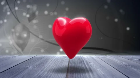 Red heart turning on glittering backgrou... | Stock Video | Pond5