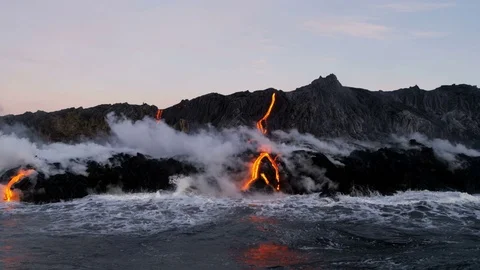 Red hot lava pouring into the Pacific oc... | Stock Video | Pond5