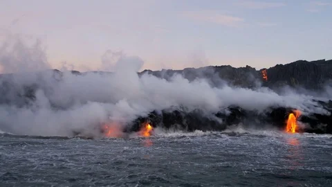 Red hot lava pouring into the Pacific oc... | Stock Video | Pond5