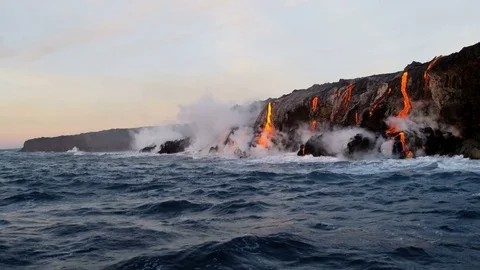 Red hot lava pouring into the Pacific oc... | Stock Video | Pond5