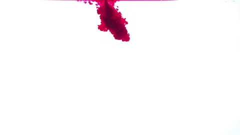Red ink on a white background | Stock Video | Pond5
