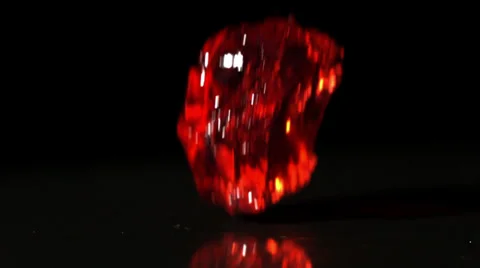 Red jelly falling and bouncing on black ... | Stock Video | Pond5