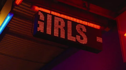Red LED sign displaying the word girls w... | Stock Video | Pond5