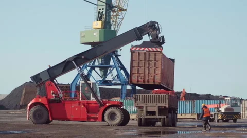 Red loading truck loads goods in heavy c... | Stock Video | Pond5