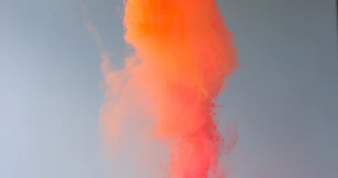 red orange powder detonate on light gray... | Stock Video | Pond5