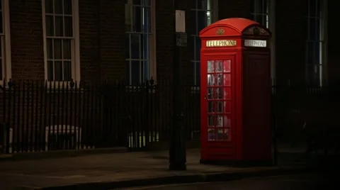 Red phone box in the night | Stock Video | Pond5