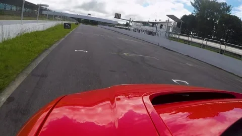 red racing car at high speed on race tra... | Stock Video | Pond5