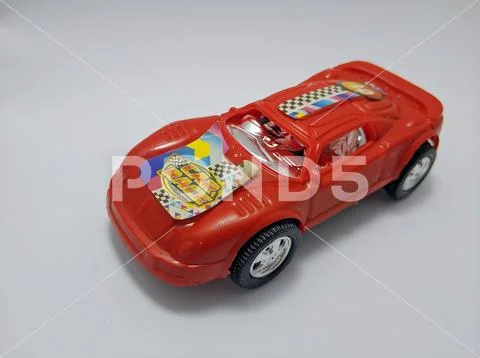 Red racing car toy isolated on white background. Stock Image #234376836