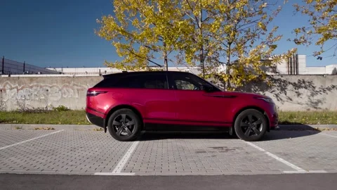 Red Range Rover Velar. Standing in the p... | Stock Video | Pond5